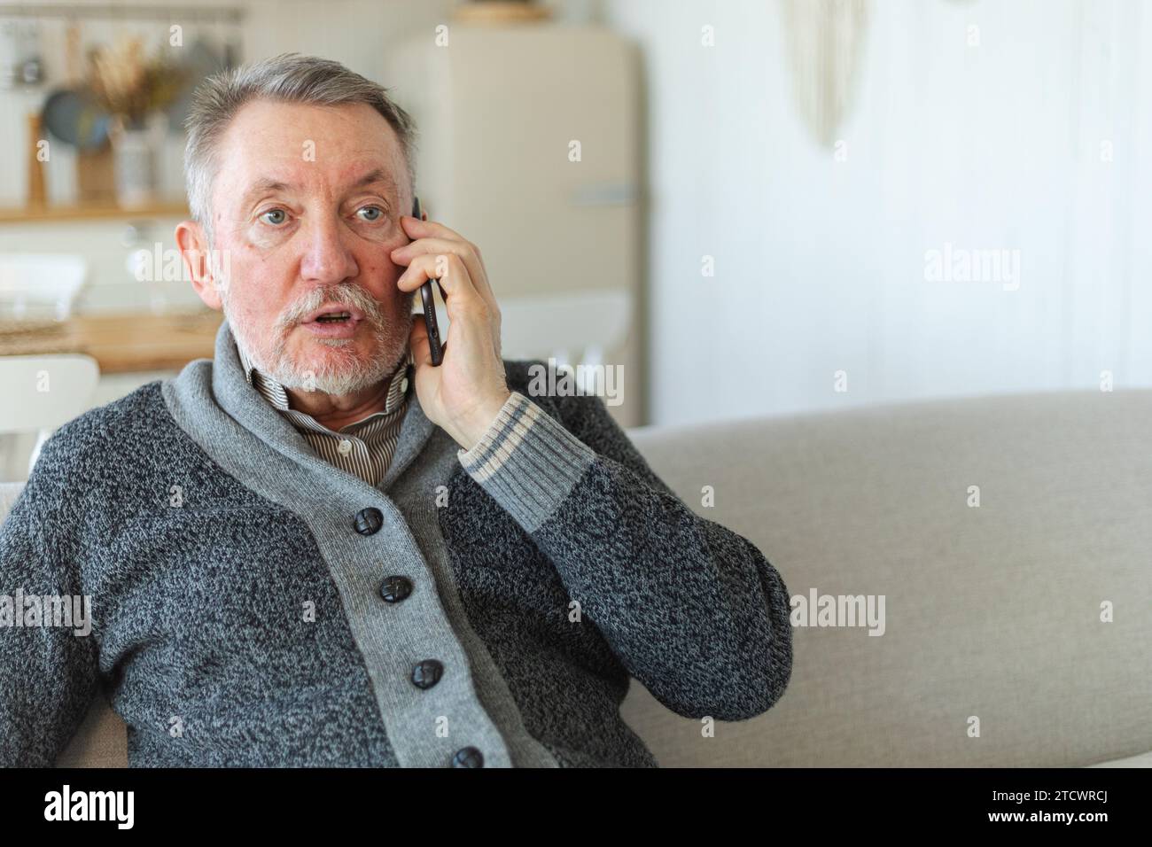 Happy middle aged senior man talking on smartphone with family friends ...