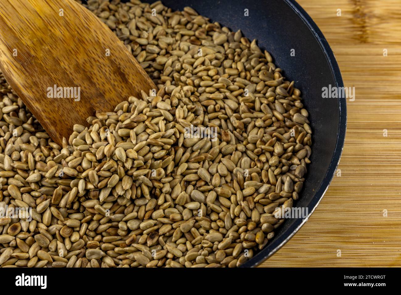 Roasted sunflower seeds in a pan, ingredients for the cake Stock Photo ...
