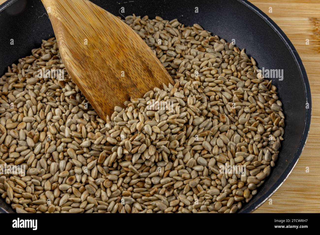 Roasted sunflower seeds in a pan, ingredients for the cake Stock Photo ...