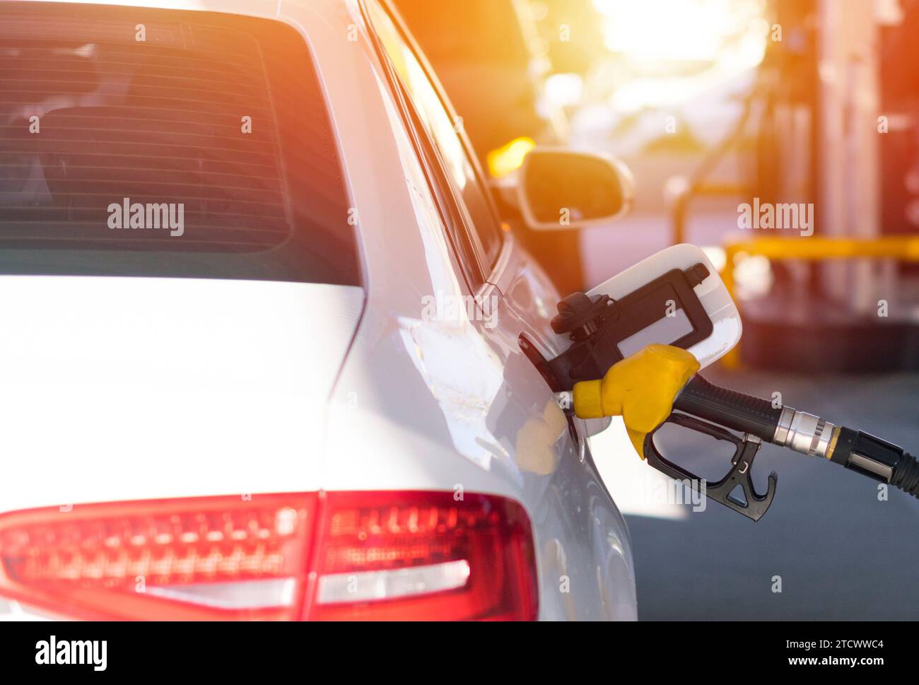 Refuel cars at the fuel pump. The driver hands, refuel and pump the car ...