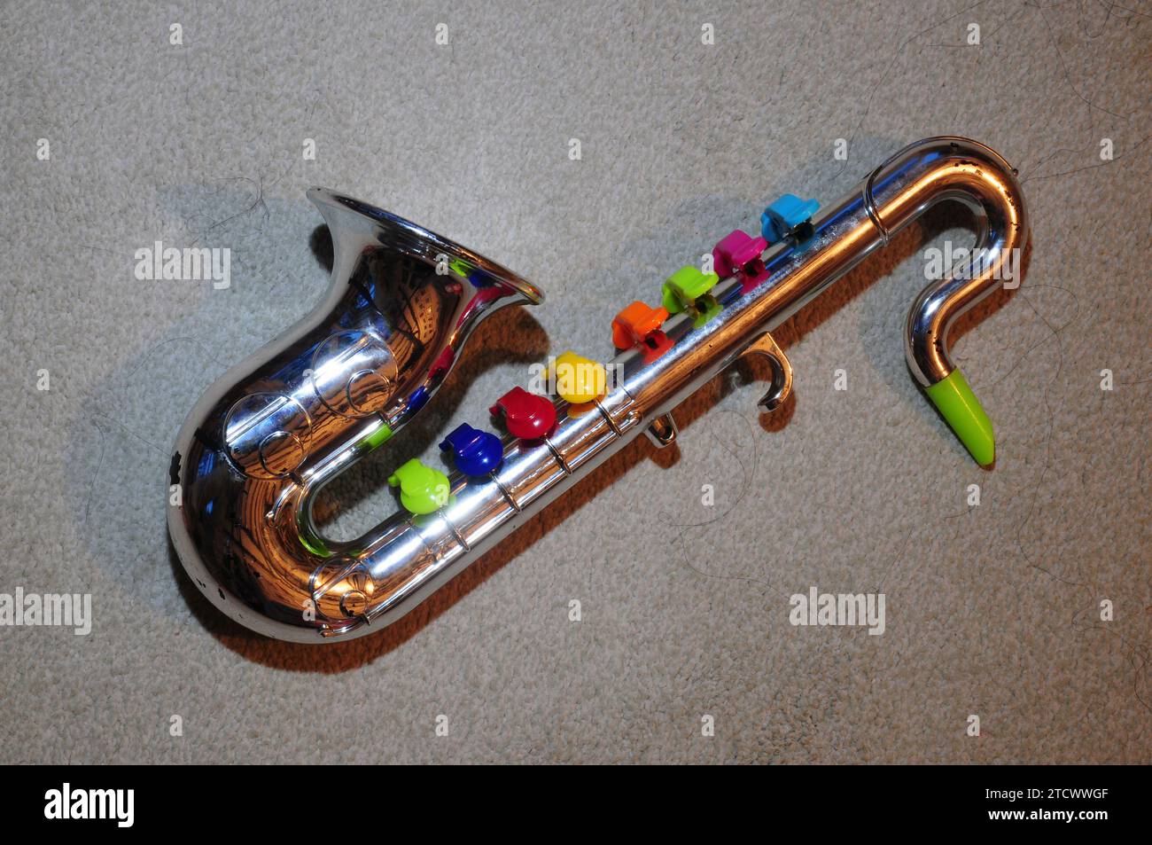 Plastic toy saxophone Stock Photo - Alamy