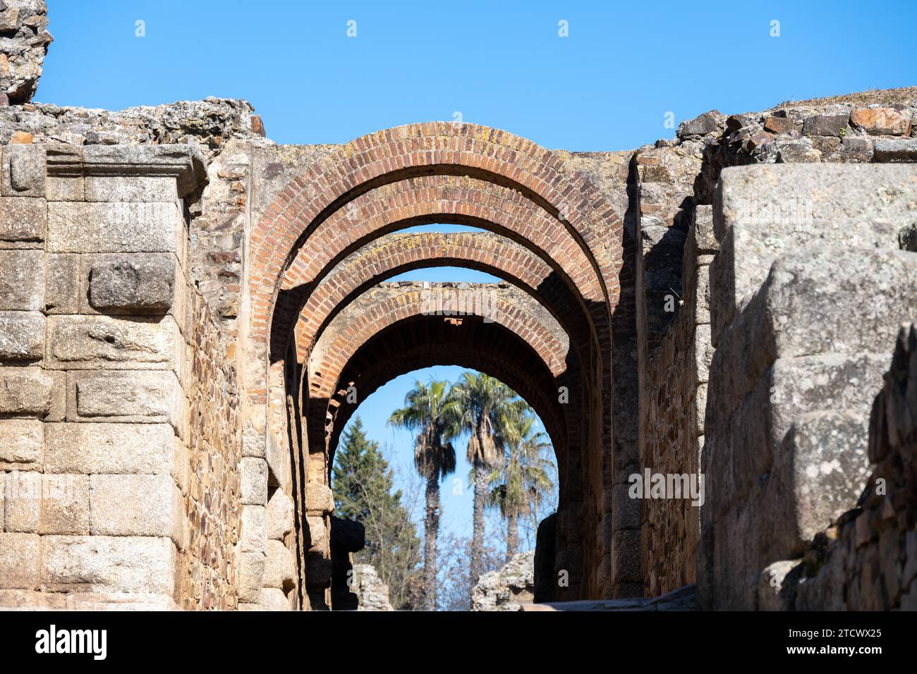 Ancient stone arches against a clear blue sky, historical ruins with ...