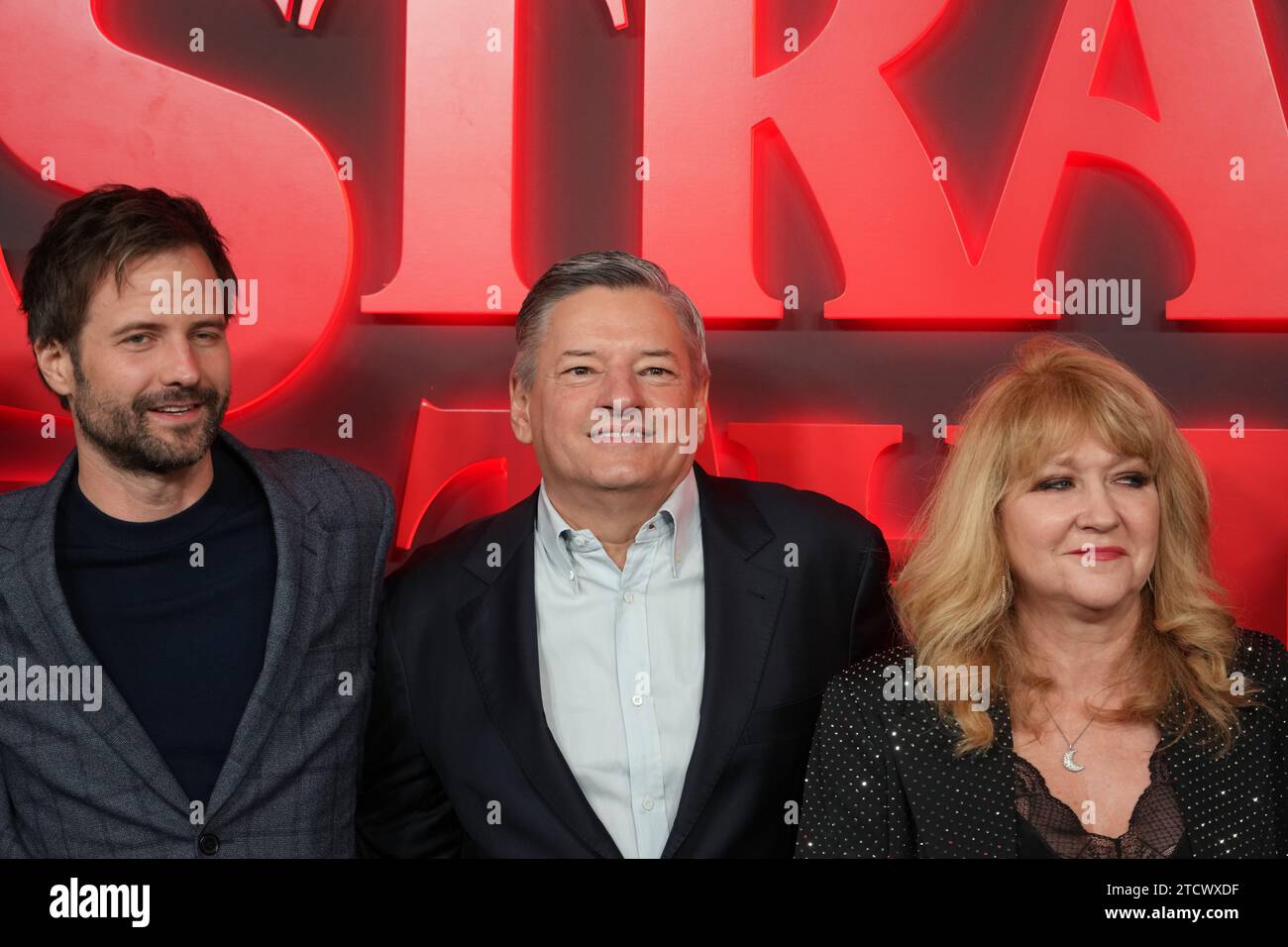 (left to right) Ross Duffer, Netflix co-CEO Ted Sarandos, and producer ...