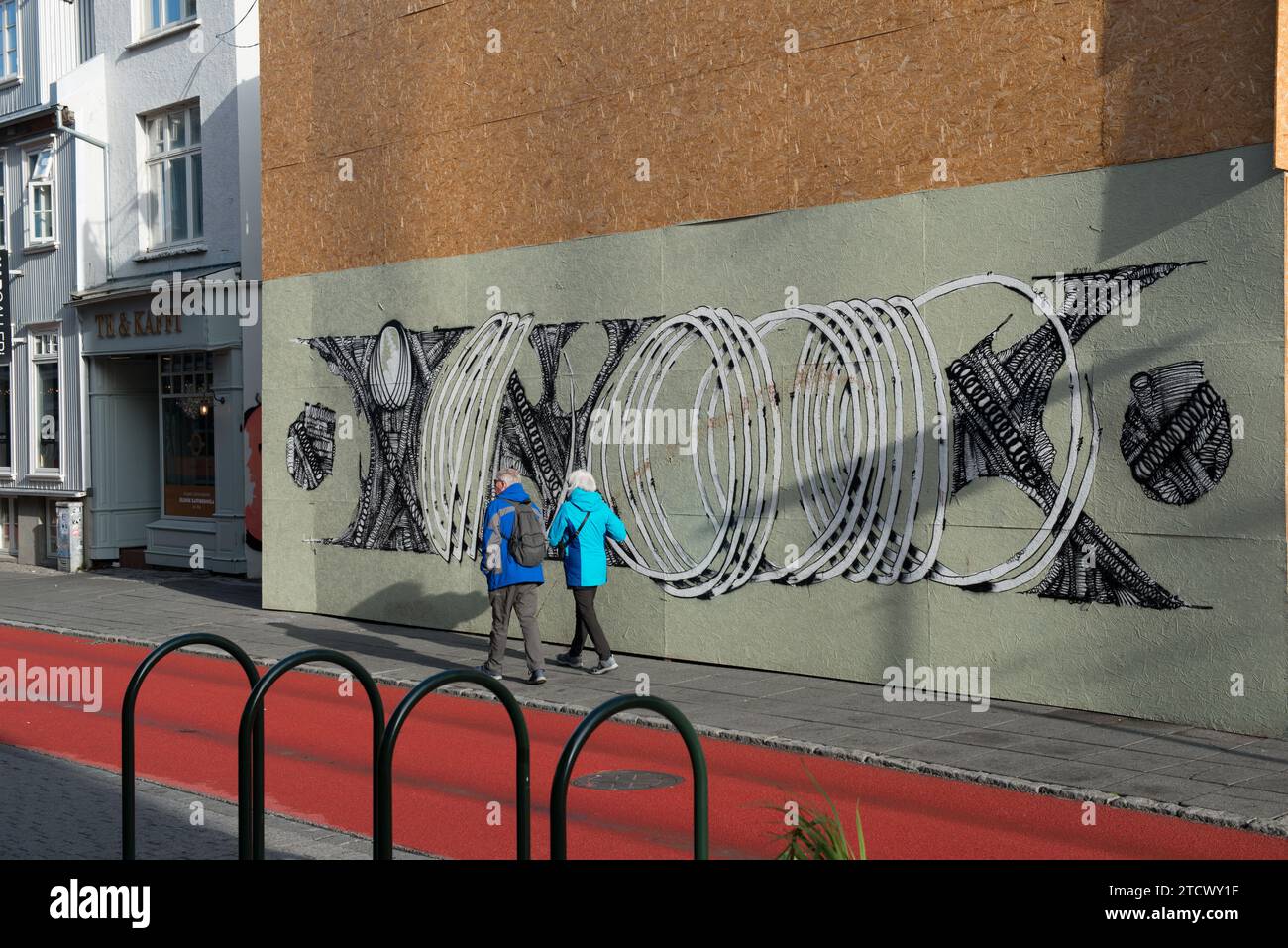 A mural design added to a plywood construction barrier in Reykjavik to ...