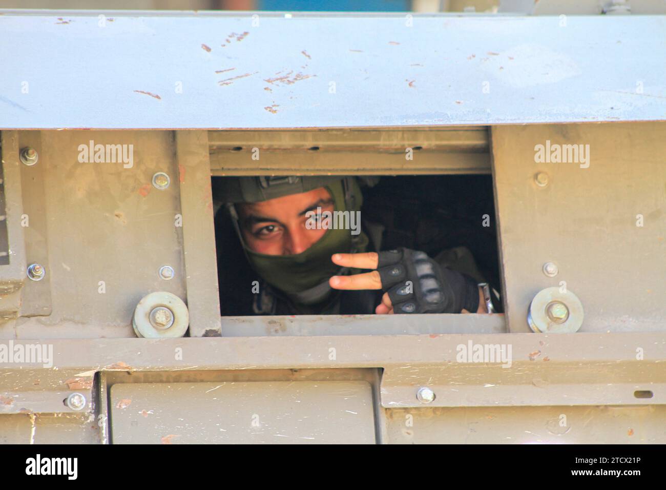 Jenin, Palestine. 14th Dec, 2023. An Israeli soldier seen gesturing ...