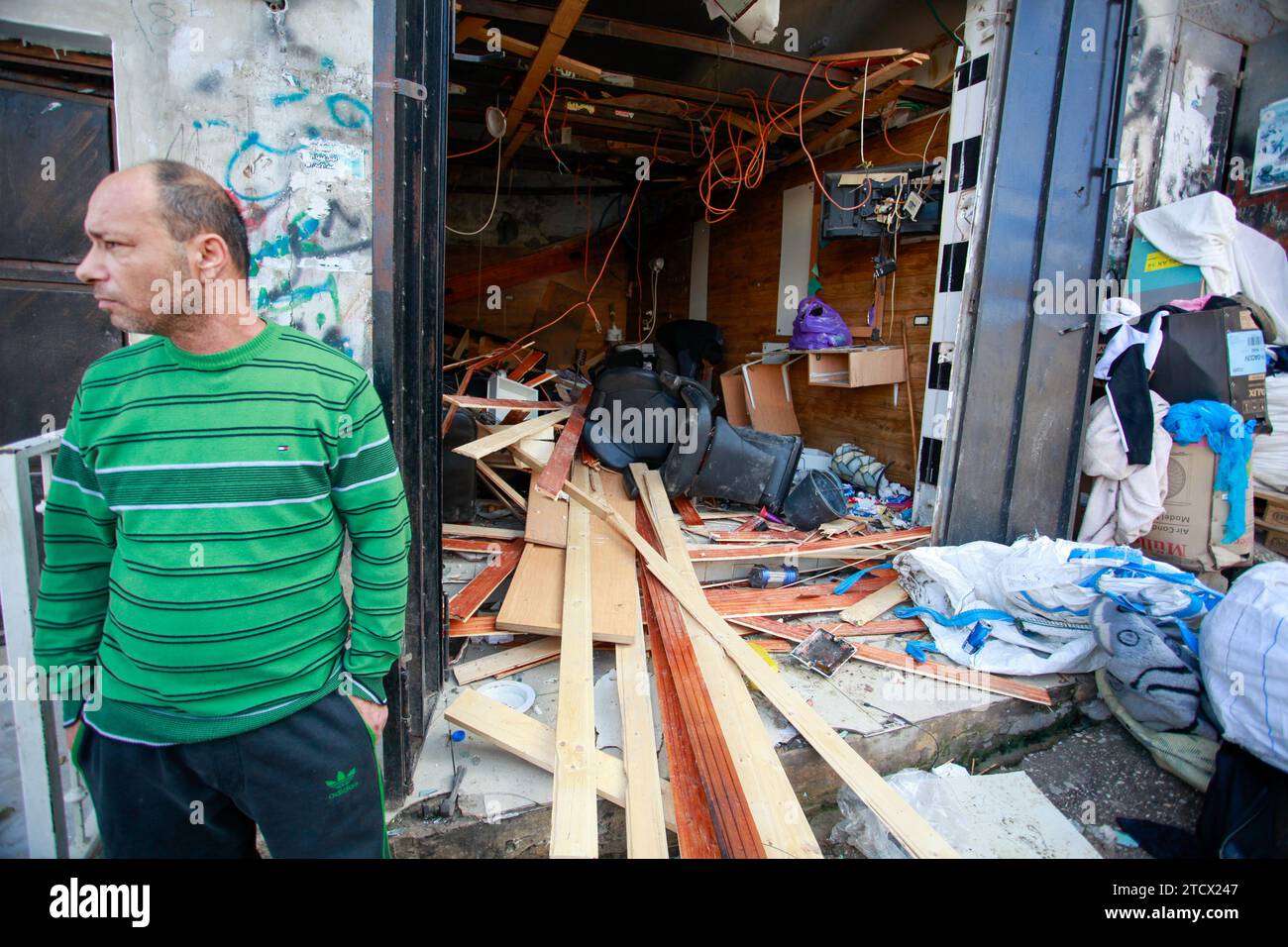 Jenin, Palestine. 14th Dec, 2023. Palestinian seen near damaged houses ...