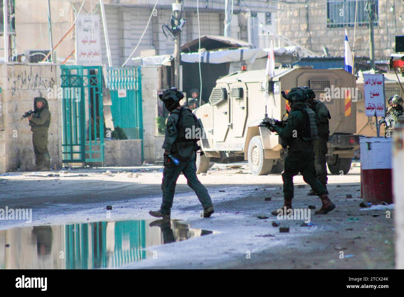 Jenin, Palestine. 14th Dec, 2023. Israeli soldiers take their positions ...
