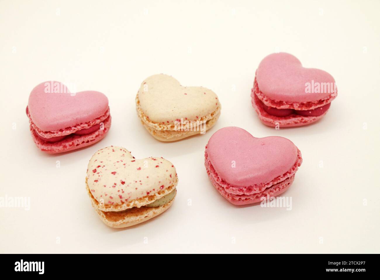 Group of heart shaped macaroons on white background Stock Photo - Alamy