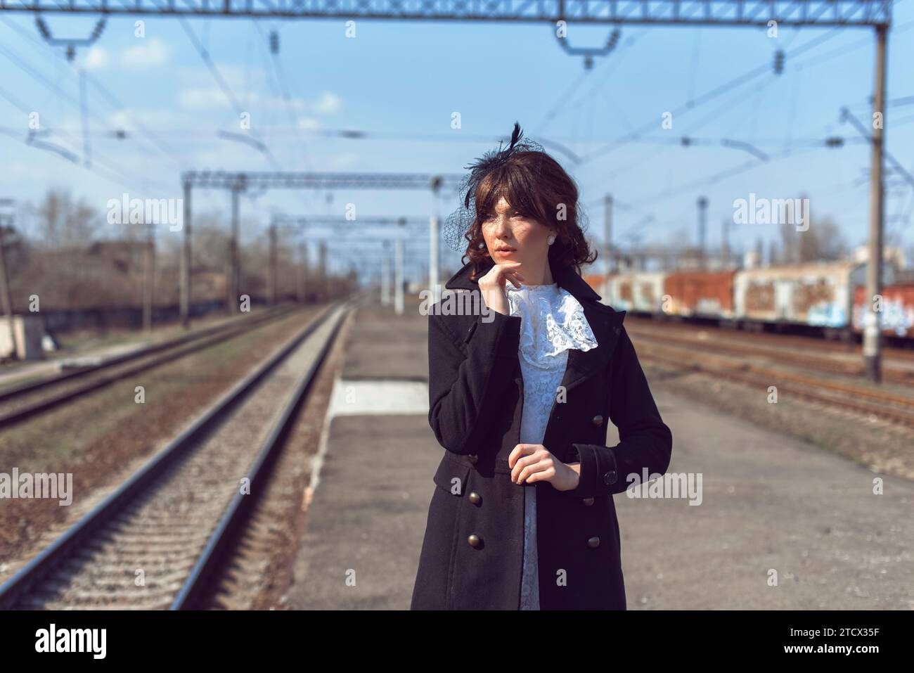 Young woman at the old train stop Stock Photo - Alamy