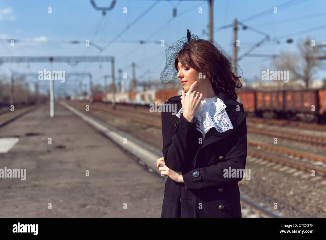 Young woman at the old train stop Stock Photo - Alamy