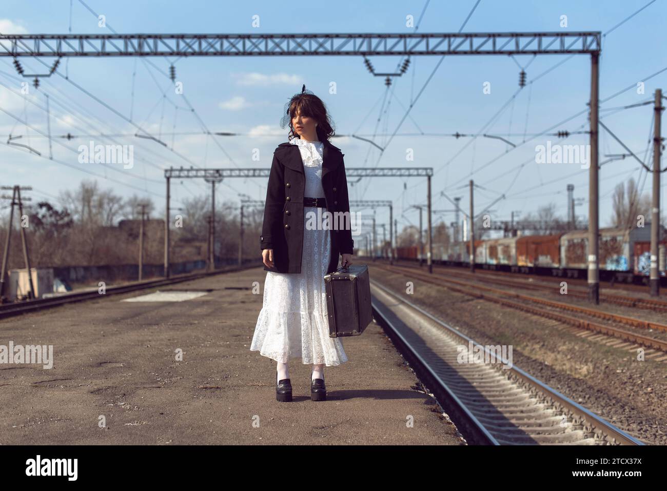 Young woman at the old train stop Stock Photo - Alamy