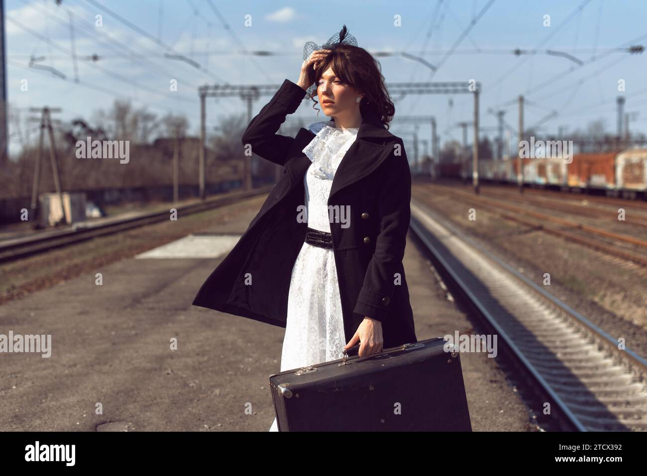 Young woman at the old train stop Stock Photo - Alamy