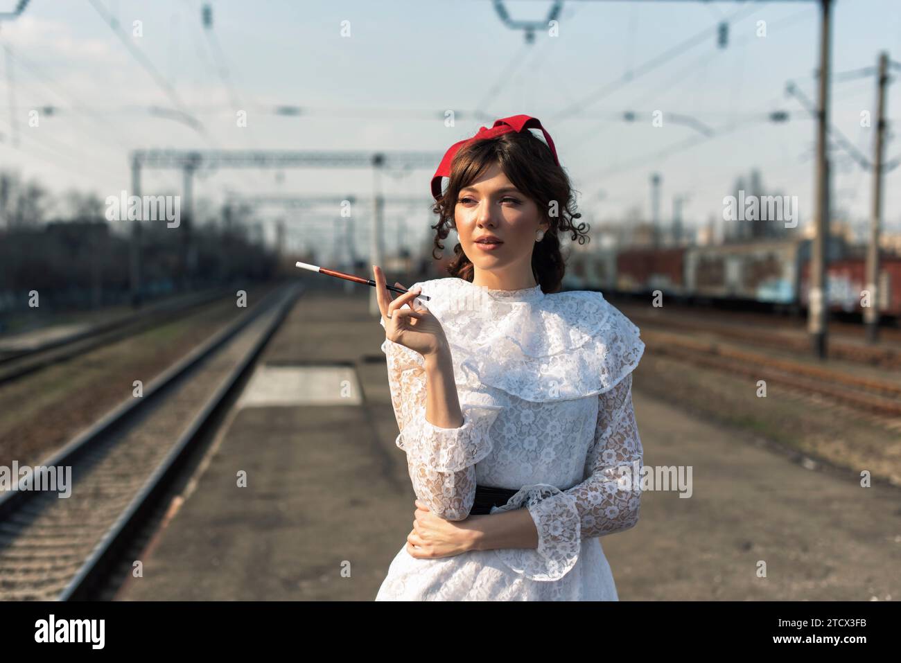 Young woman at the old train stop Stock Photo - Alamy