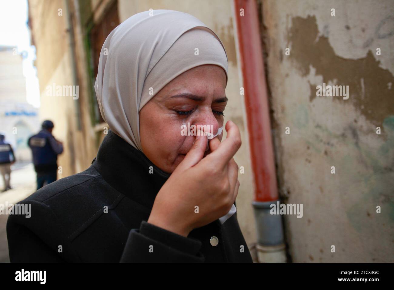 Jenin, Palestine. 14th Dec, 2023. A Palestinian seen touching her ...