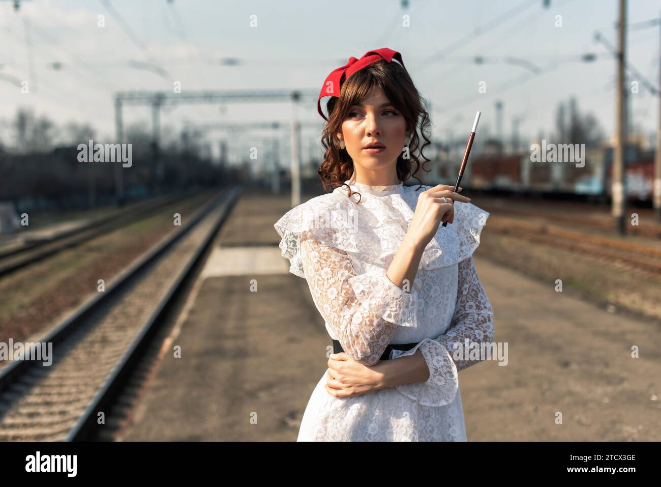 Young woman at the old train stop Stock Photo - Alamy
