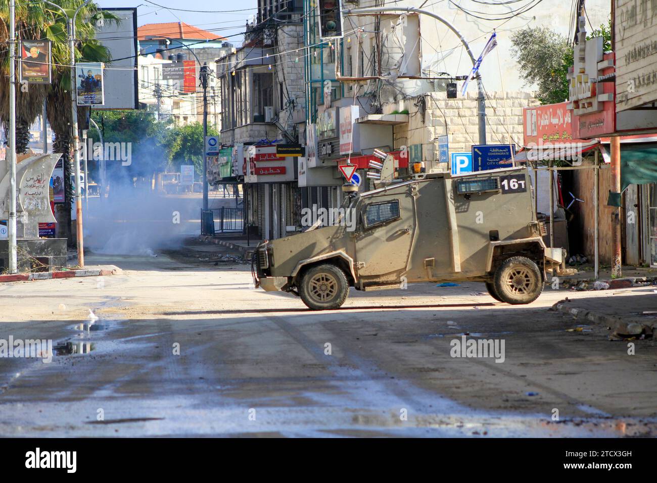 Jenin, Palestine. 14th Dec, 2023. Israeli military vehicles surround ...