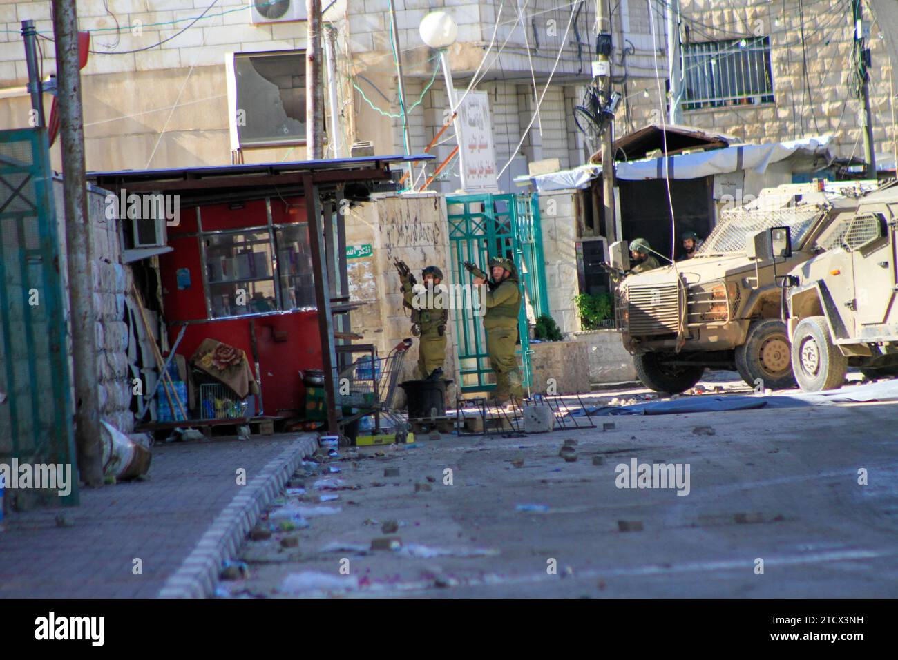 Jenin, Palestine. 14th Dec, 2023. Israeli soldiers take their positions ...