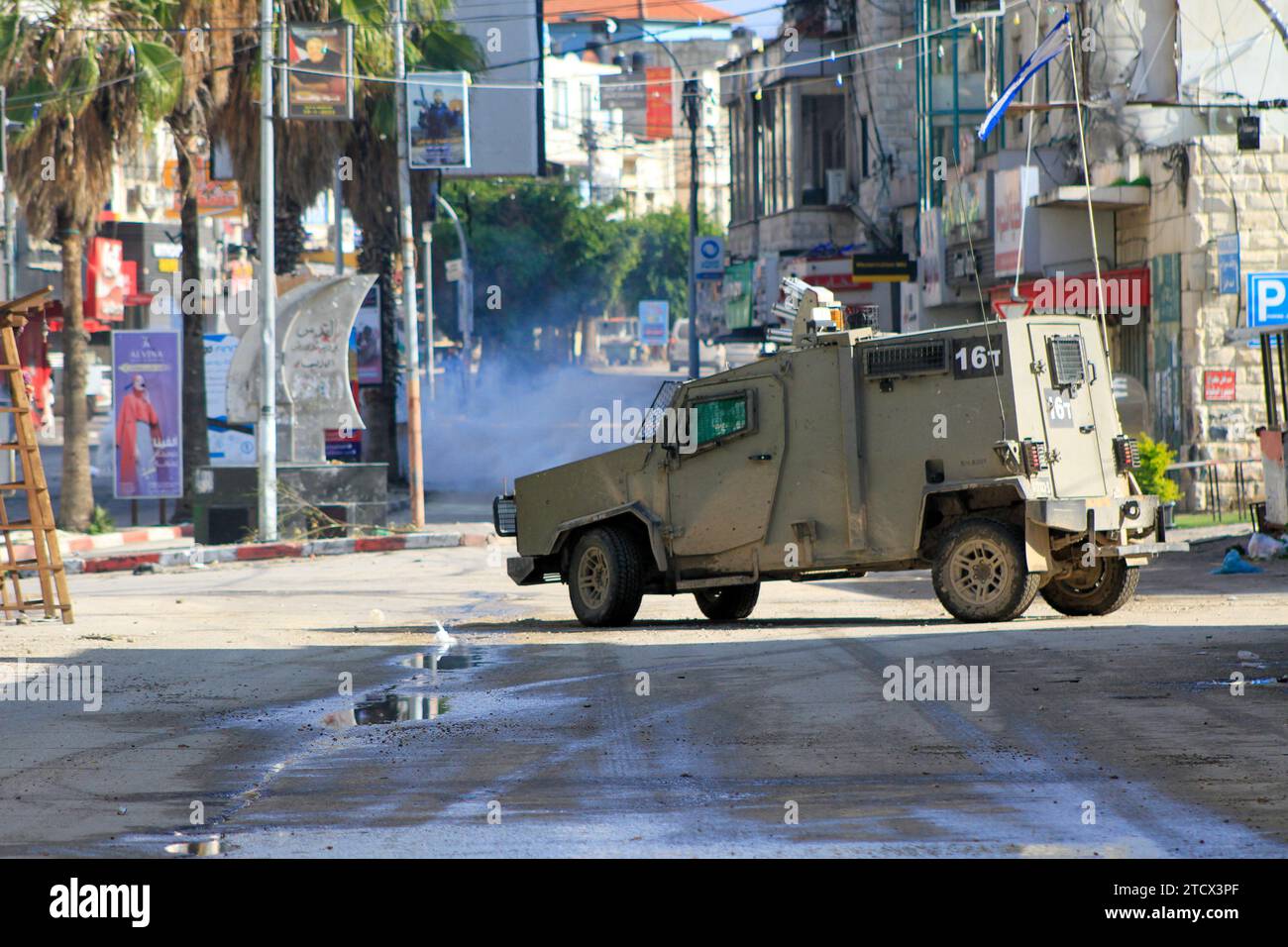 Jenin, Palestine. 14th Dec, 2023. Israeli military vehicles surround ...