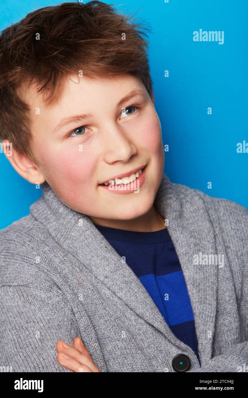 Fashion, thinking and boy child in studio with arms crossed confidence ...