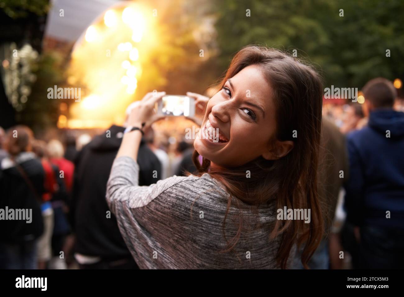 Woman, music festival and cellphone picture of stage entertainment ...