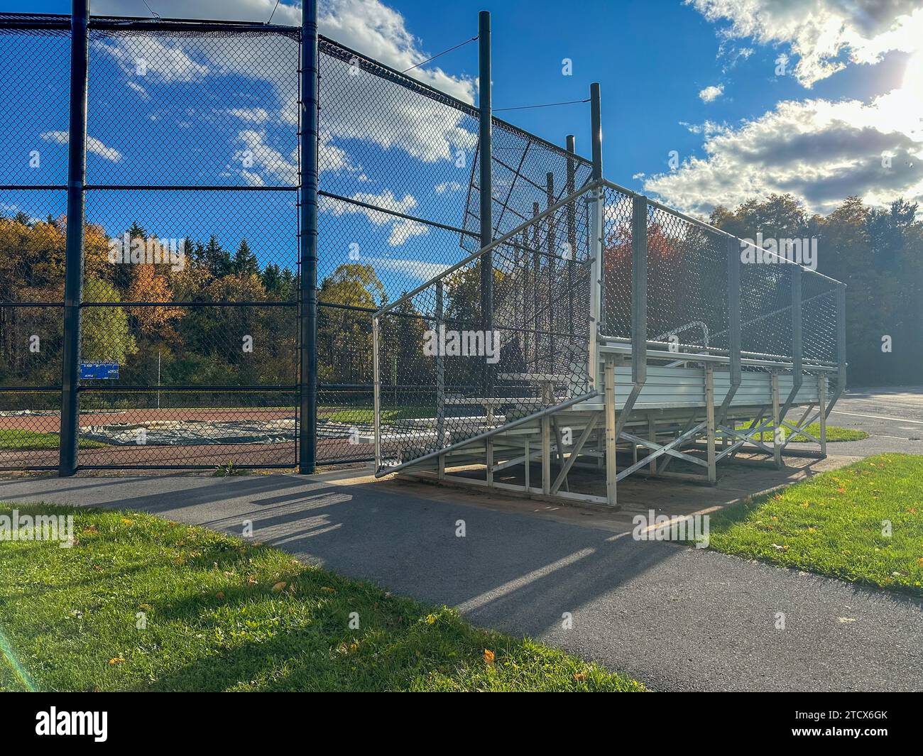 View of typical angle frame bleacher and backstop at a nondescript high ...