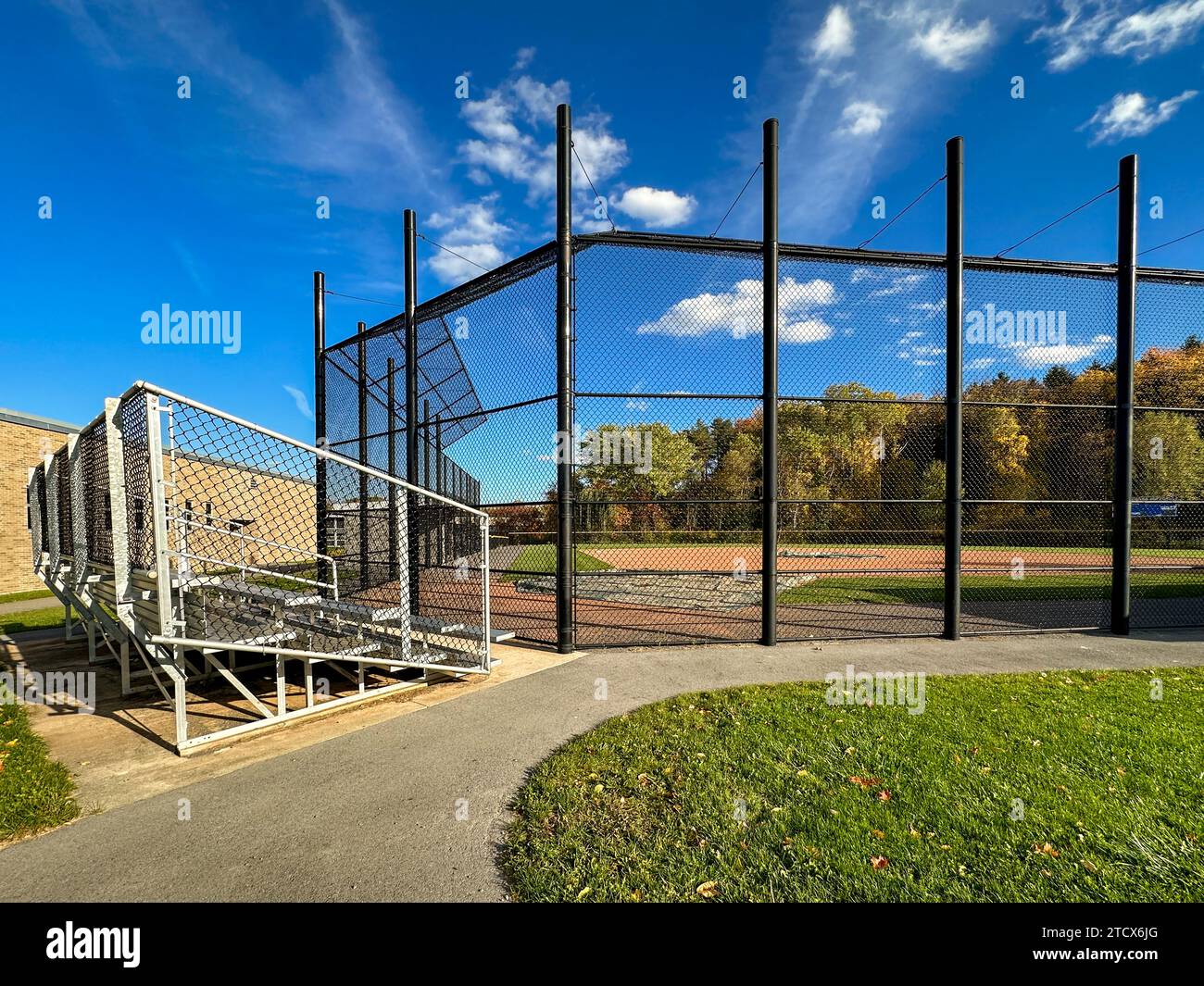 View of typical angle frame bleacher and backstop at a nondescript high ...