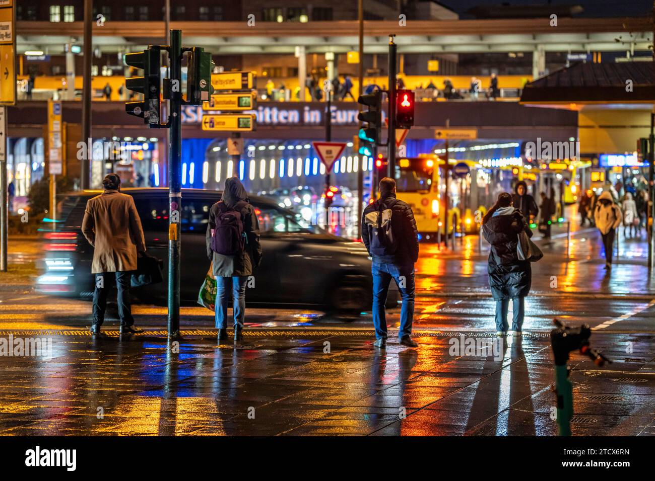 Pedestrian, in rainy weather, at a traffic light, pedestrian crossing ...