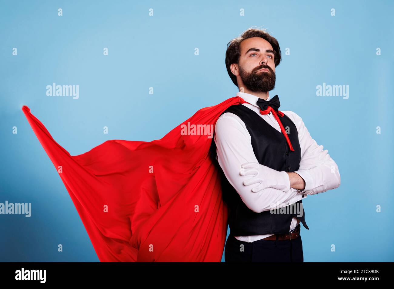 Powerful superhero wears red cape and feeling strong to save citizens ...