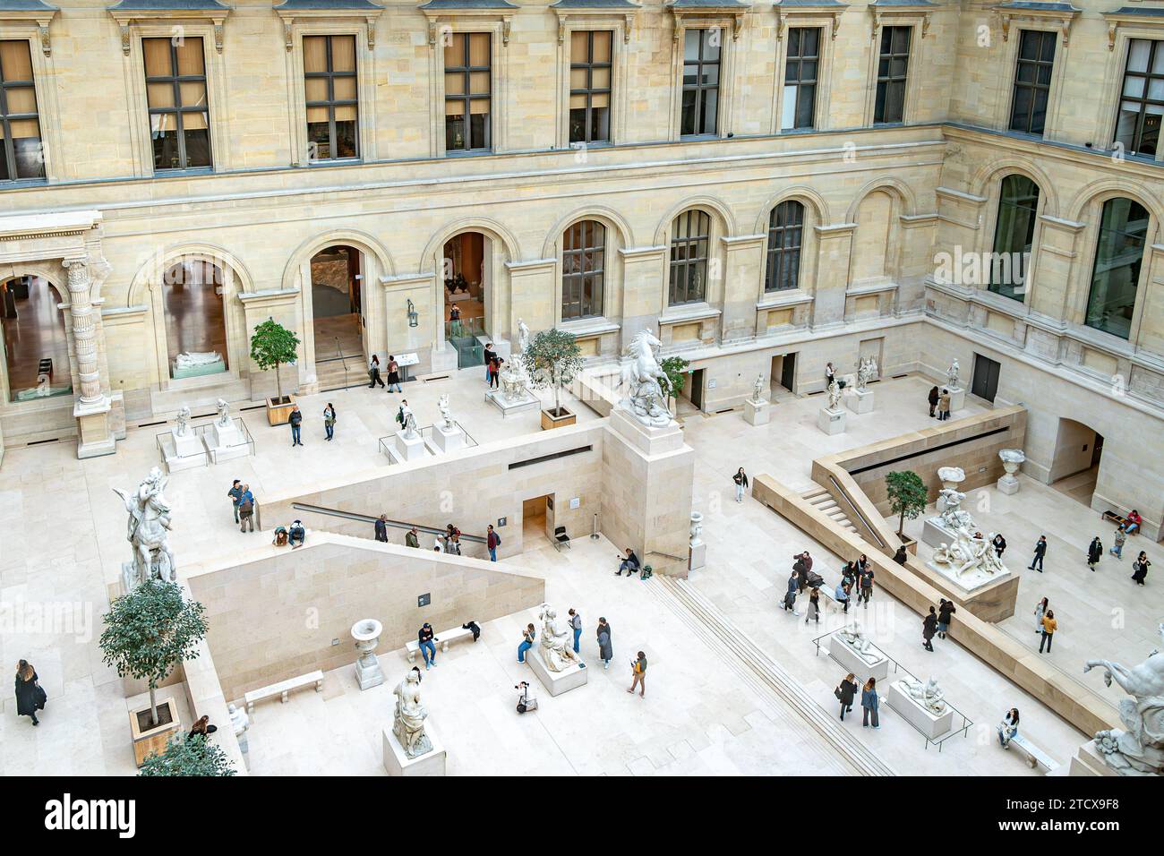 Sculptures in the glass-roofed courtyard known as Cour Marly in the ...