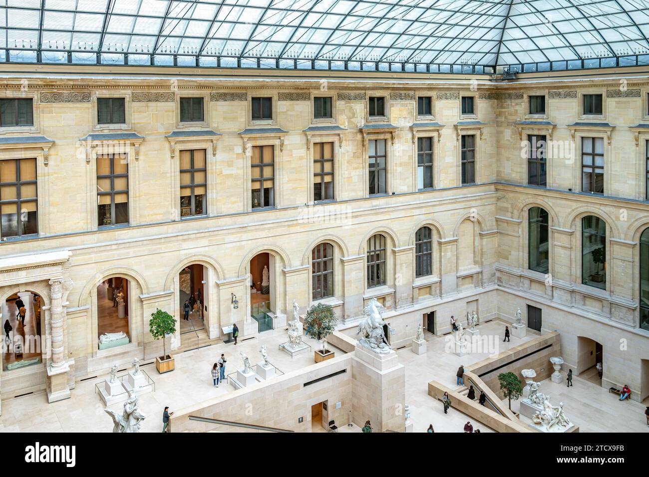 Sculptures in the glass-roofed courtyard known as Cour Marly in the ...