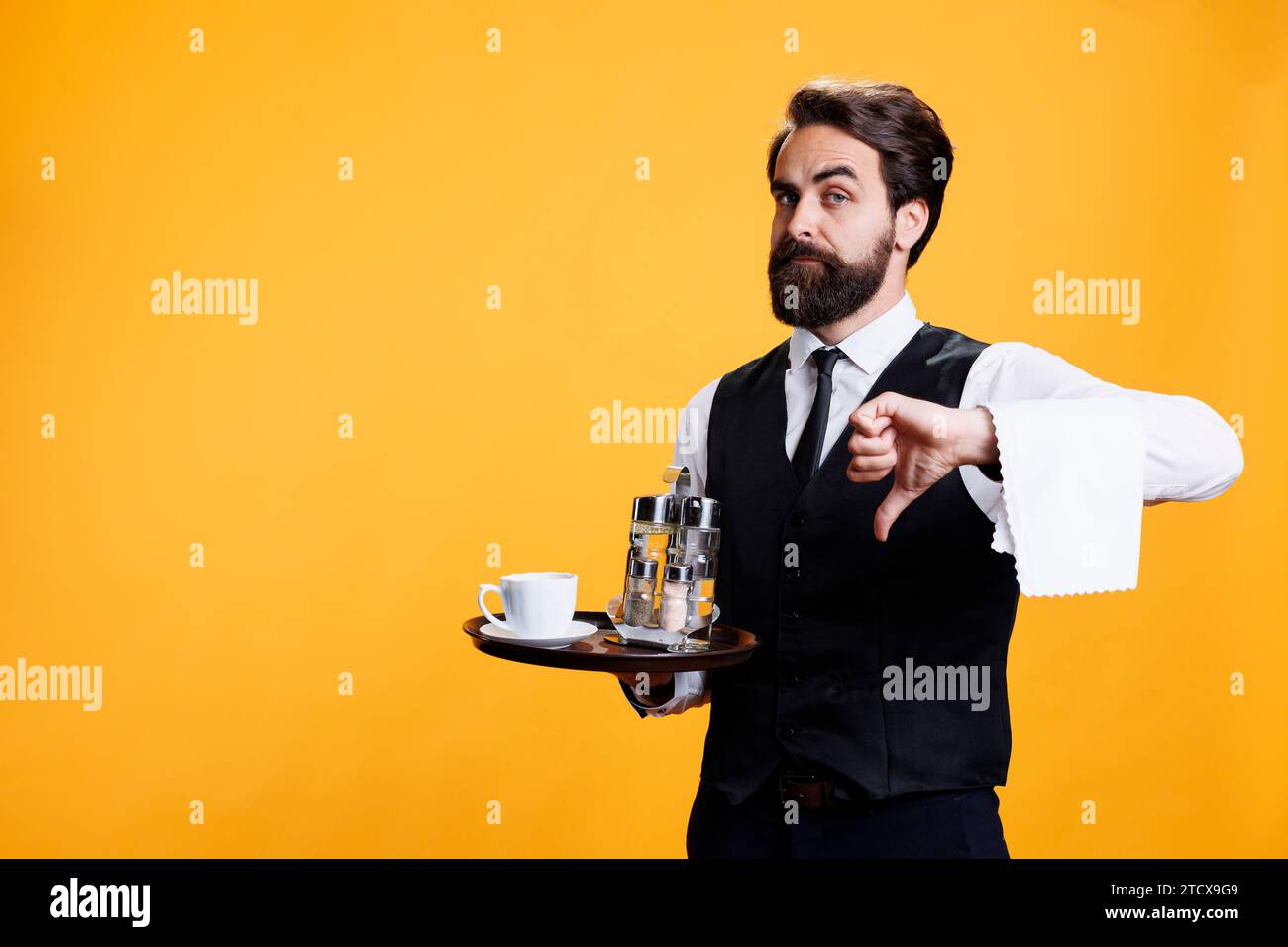 Restaurant employee gives thumbs down in studio, presenting negative ...