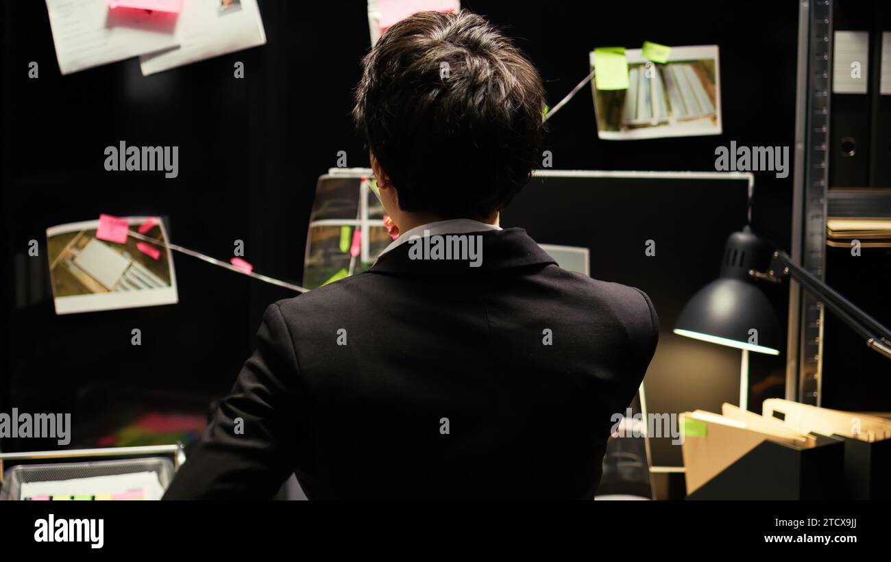 Investigator doing detective work with clues, trying to uncover new ...