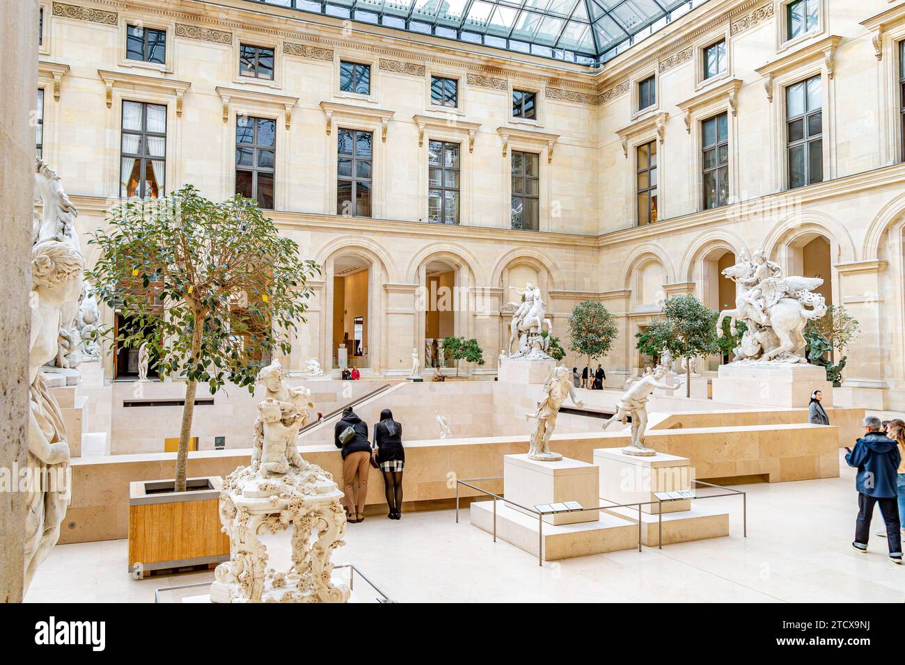 Sculptures in the glass-roofed courtyard known as Cour Marly in the ...