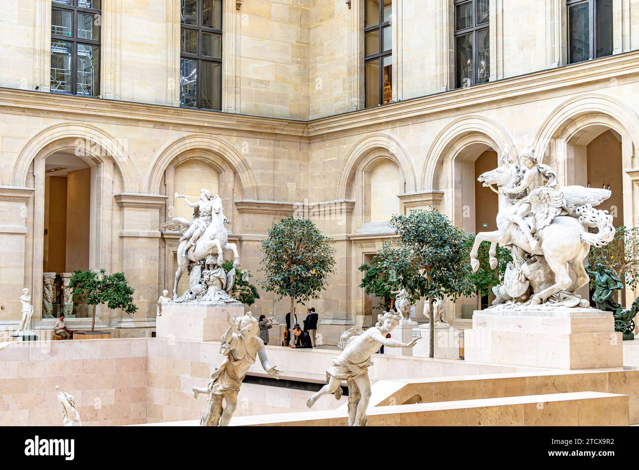 Sculptures in the glass-roofed courtyard known as Cour Marly in the ...