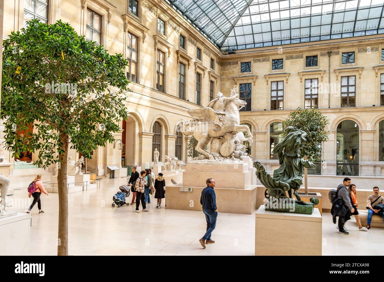 Sculptures in the glass-roofed courtyard known as Cour Marly in the ...