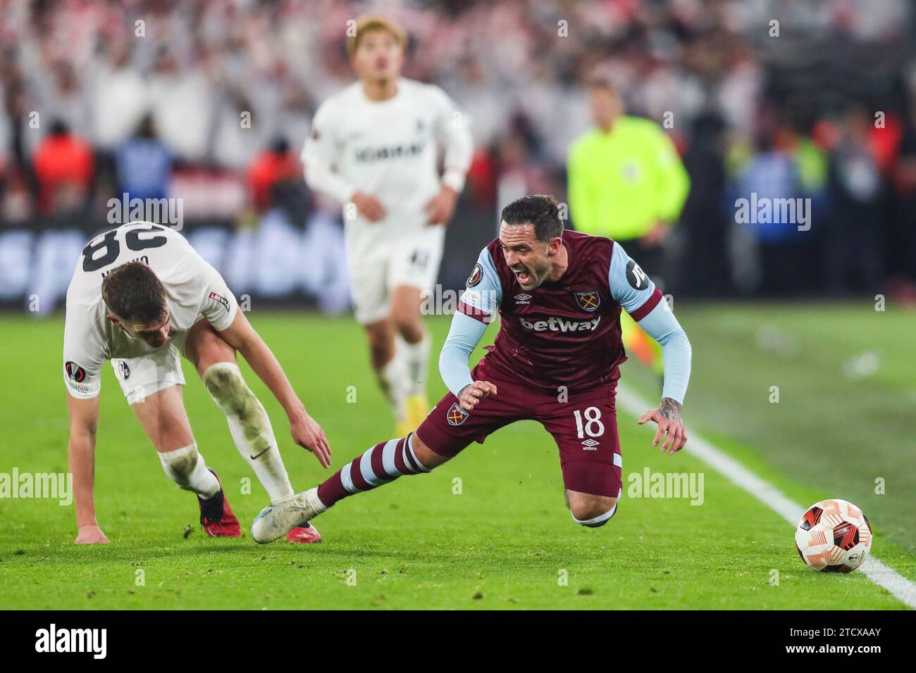West Ham United's Danny Ings feels pressure from SC Freiburg's Matthias ...