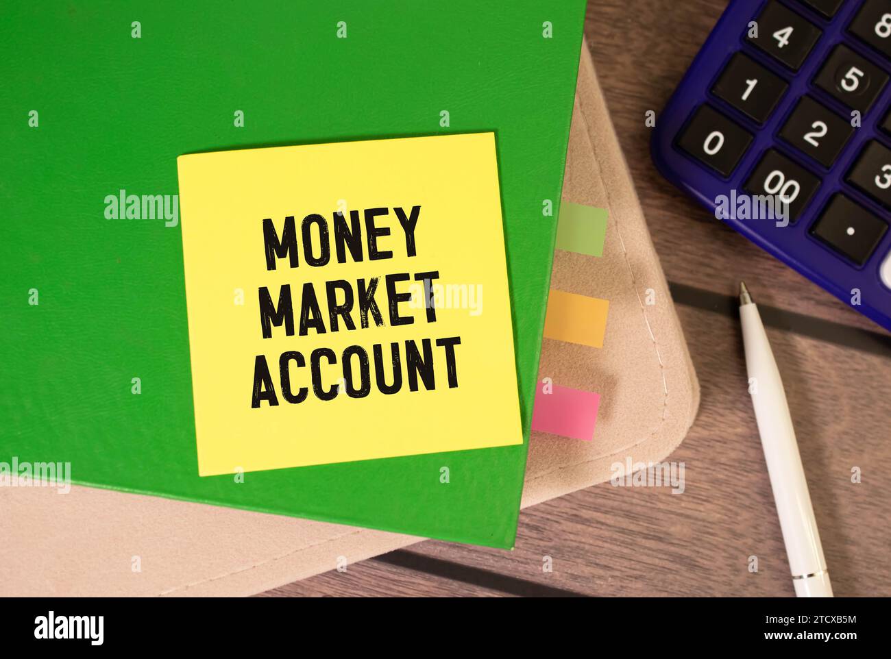 MONEY MARKET ACCOUNT written on paper with office tools and keyboard on ...