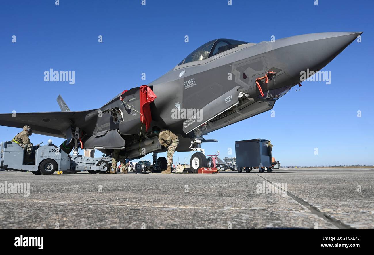 U.S. Air Force Airmen load a munition onto an F-35 Lightning II in ...