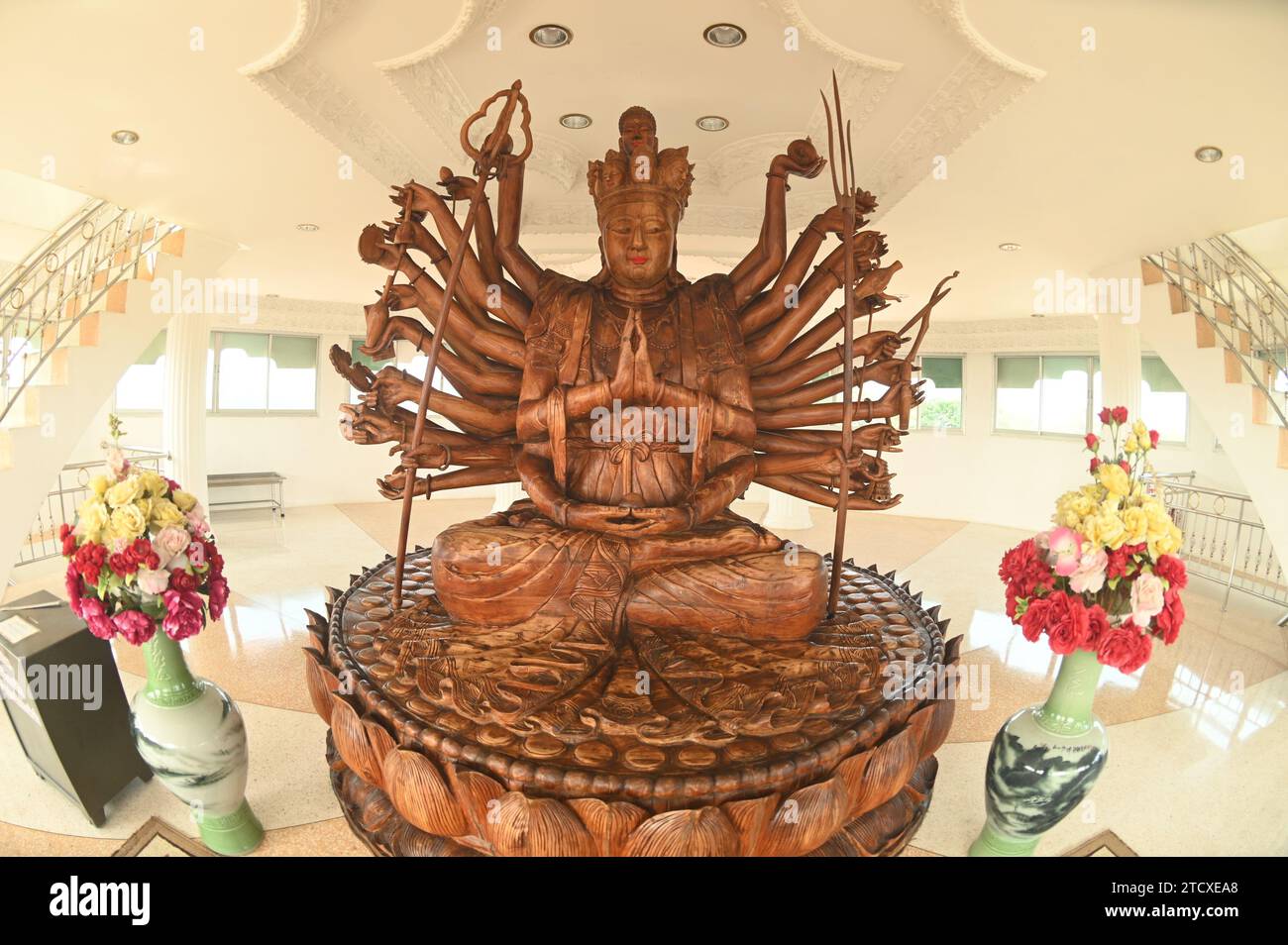 The goddess Guanyin is carved from a large piece of fragrant sandalwood ...