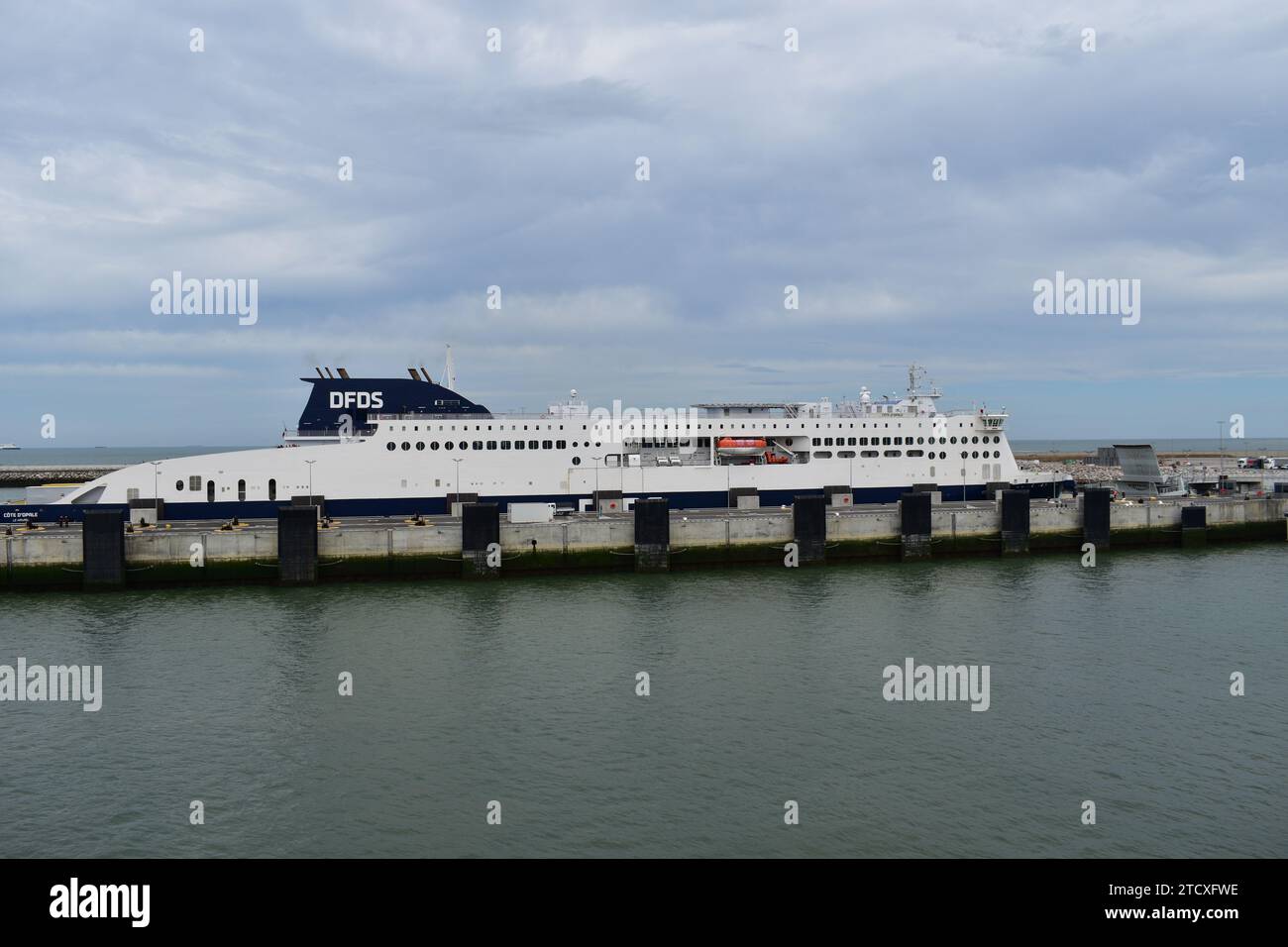 DFDS car ferry boat docked at a concrete pier in the Calais car ferry ...