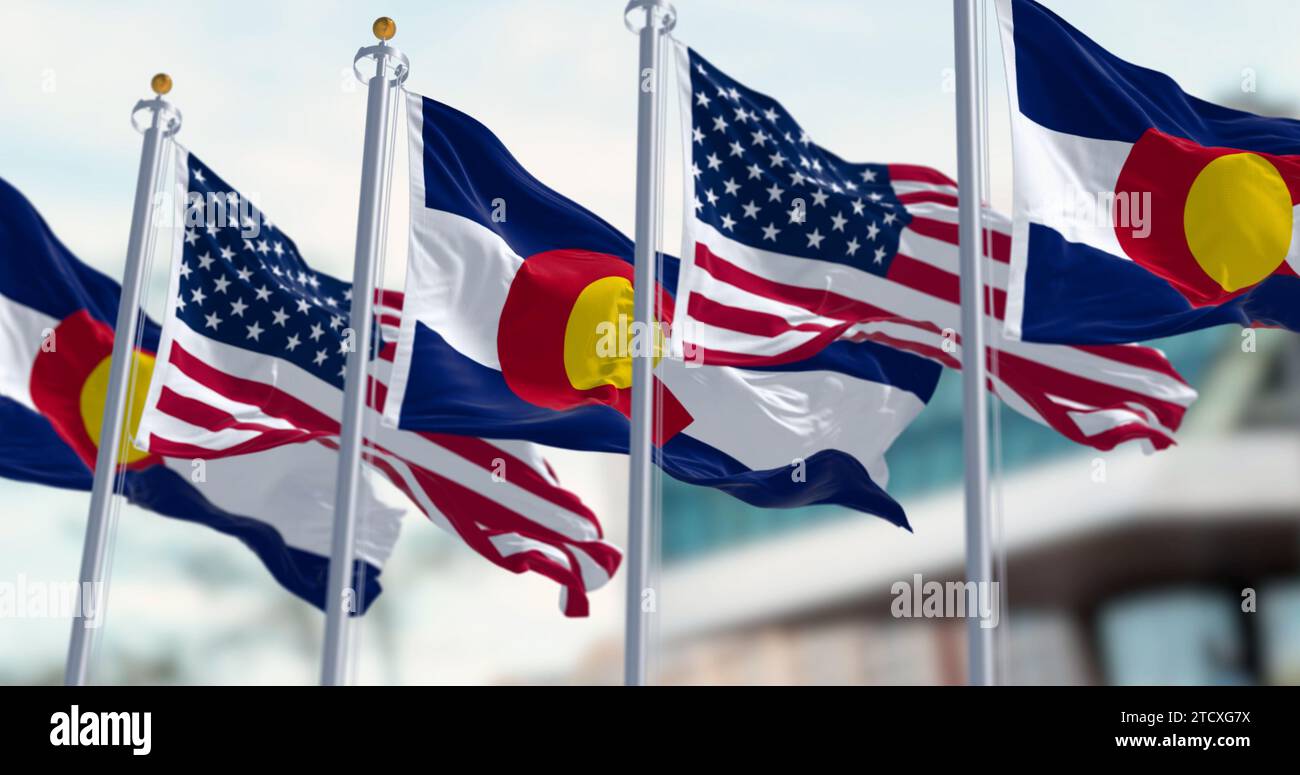 Colorado state flags waving with the national flags of the United ...