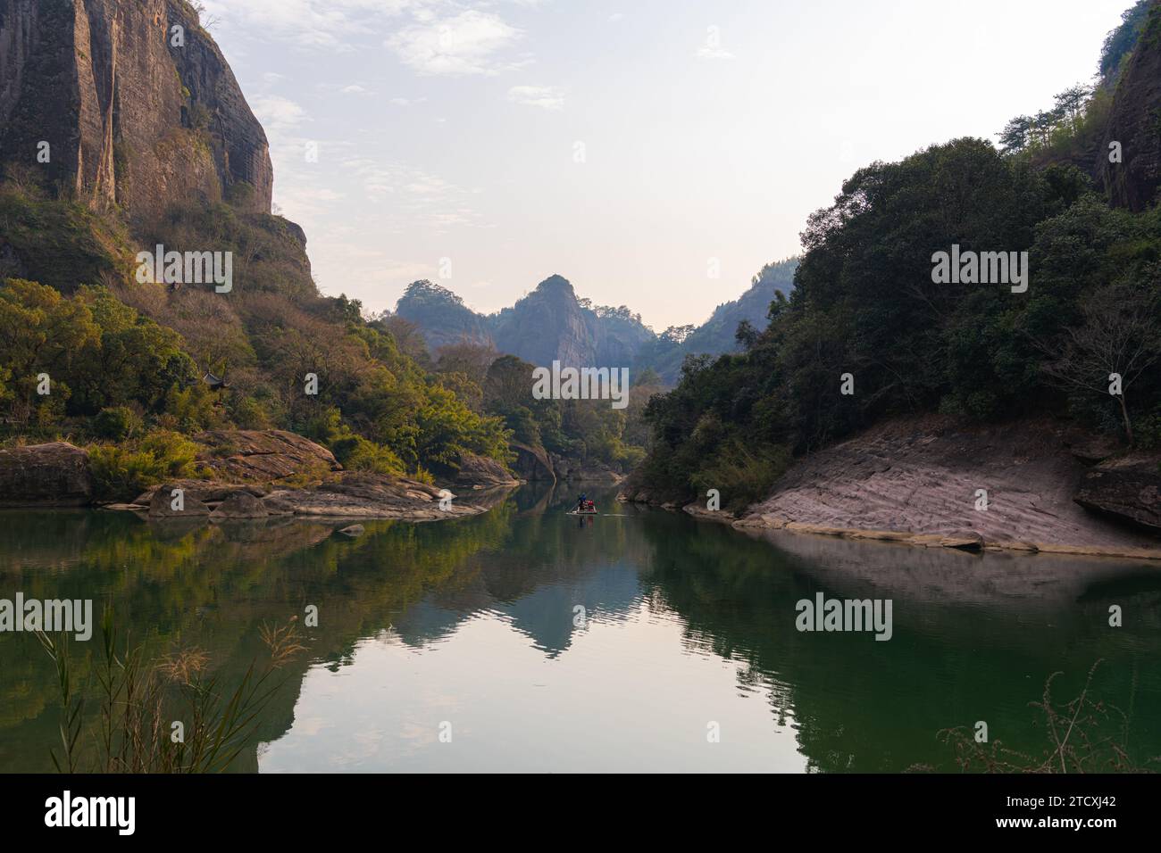The emerald green water of the Nine Bend River or Jiuxi river through ...