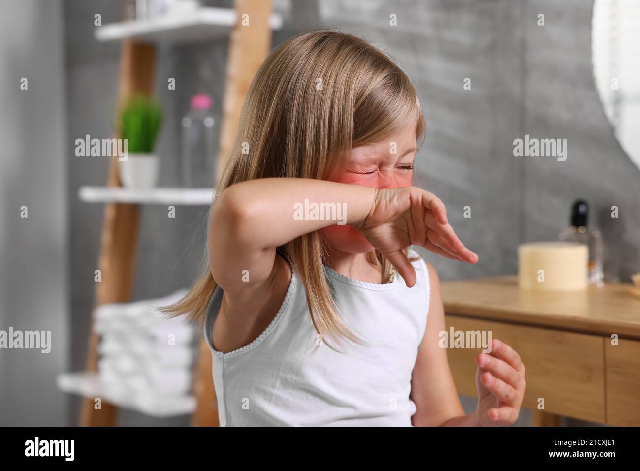 Suffering from allergy. Little girl sneezing in bathroom Stock Photo ...