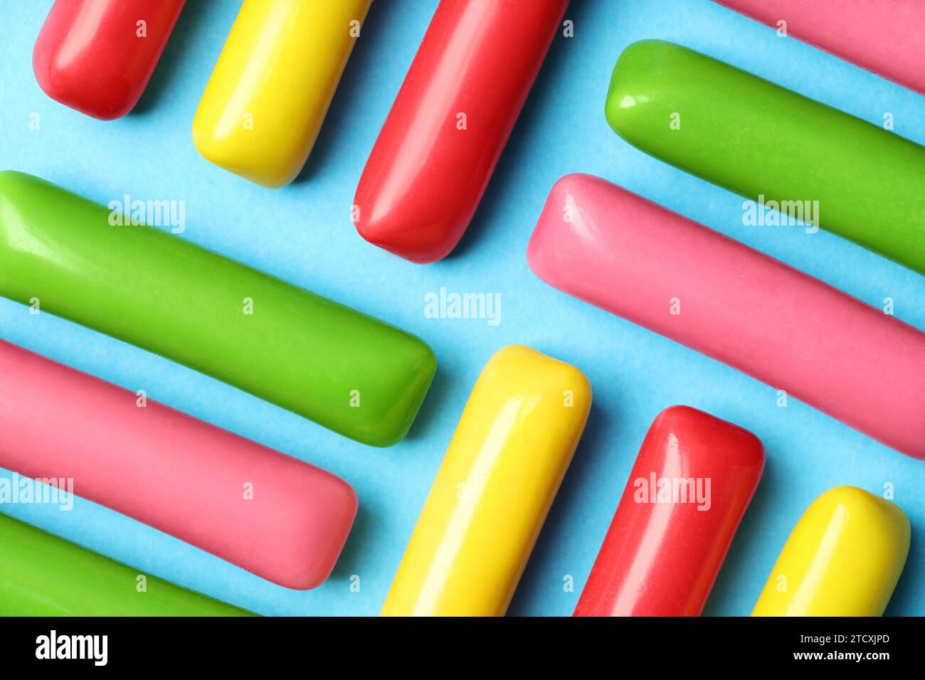 Many tasty bubble gums on light blue background, flat lay Stock Photo ...