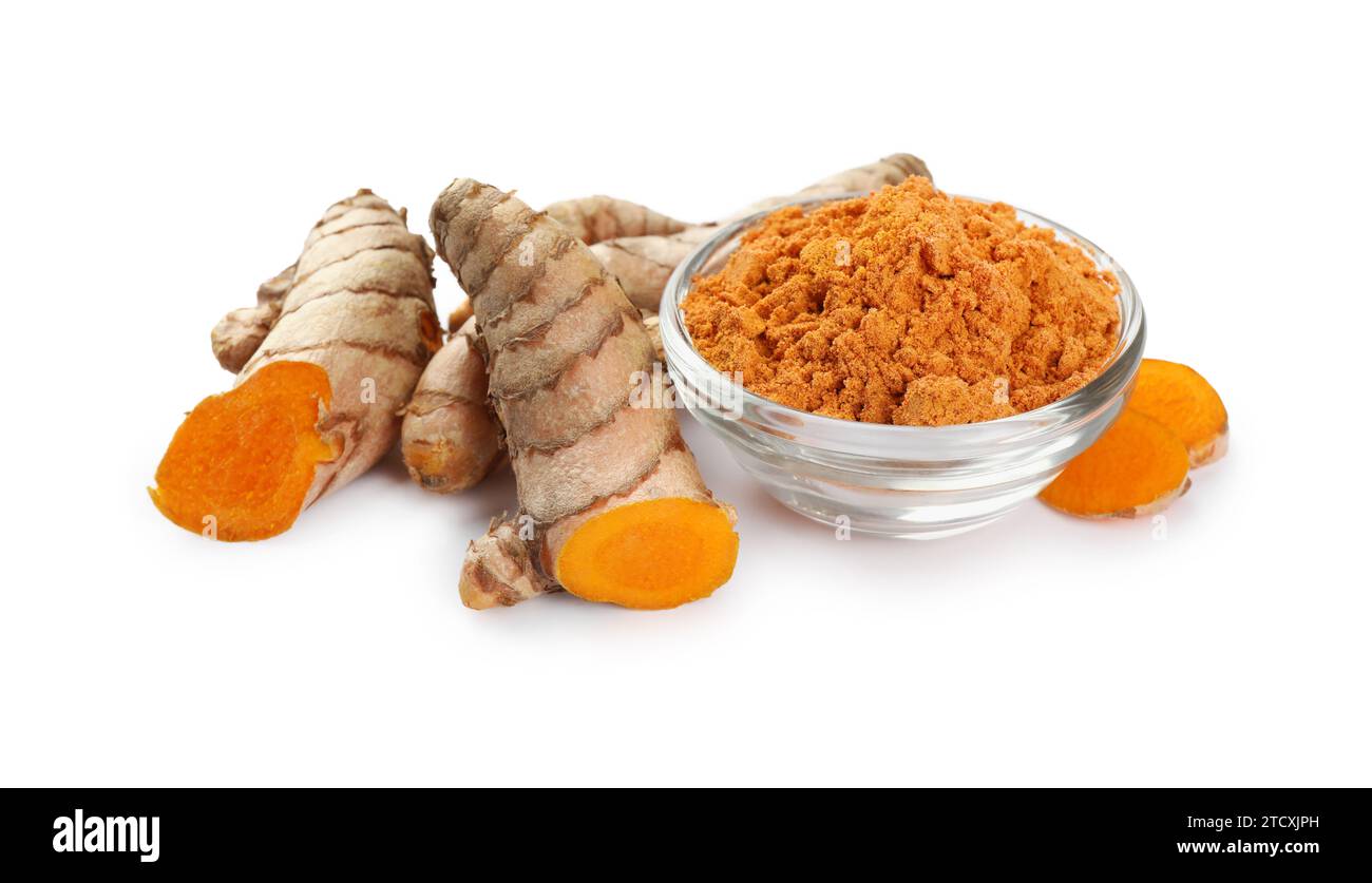 Bowl with aromatic turmeric powder and raw roots isolated on white ...