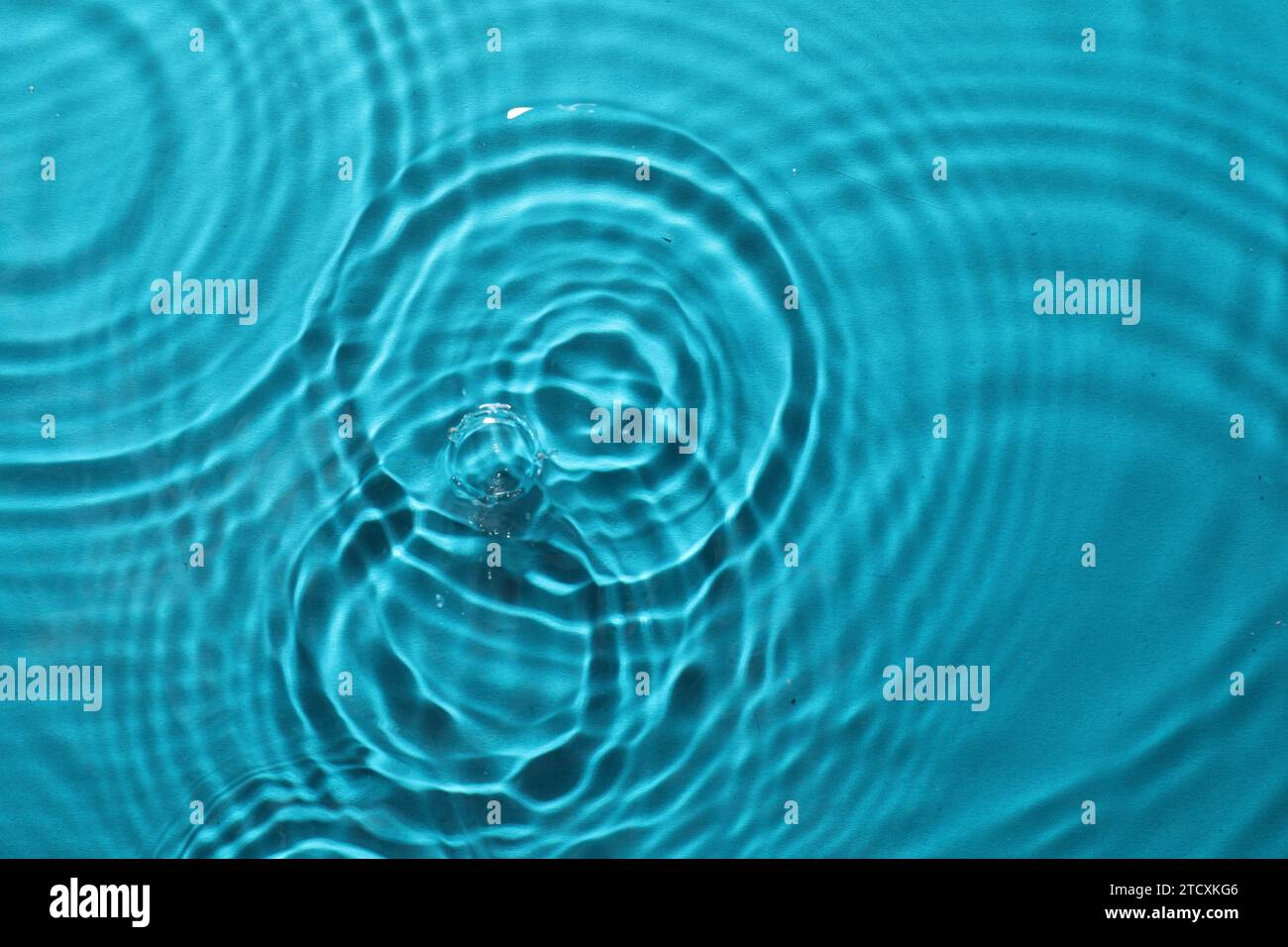 Rippled surface of clear water on light blue background, top view Stock ...