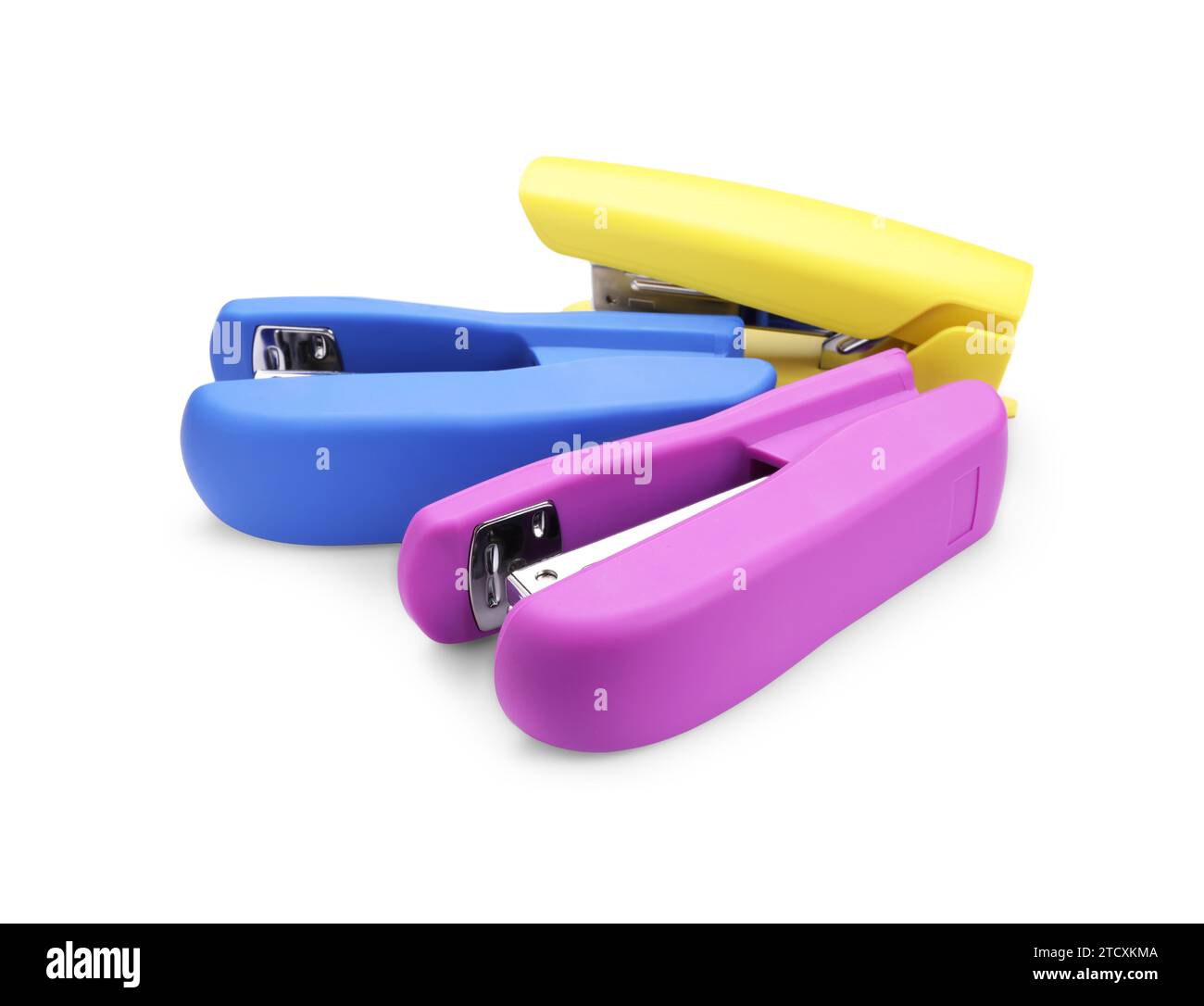 Many new bright staplers isolated on white Stock Photo - Alamy