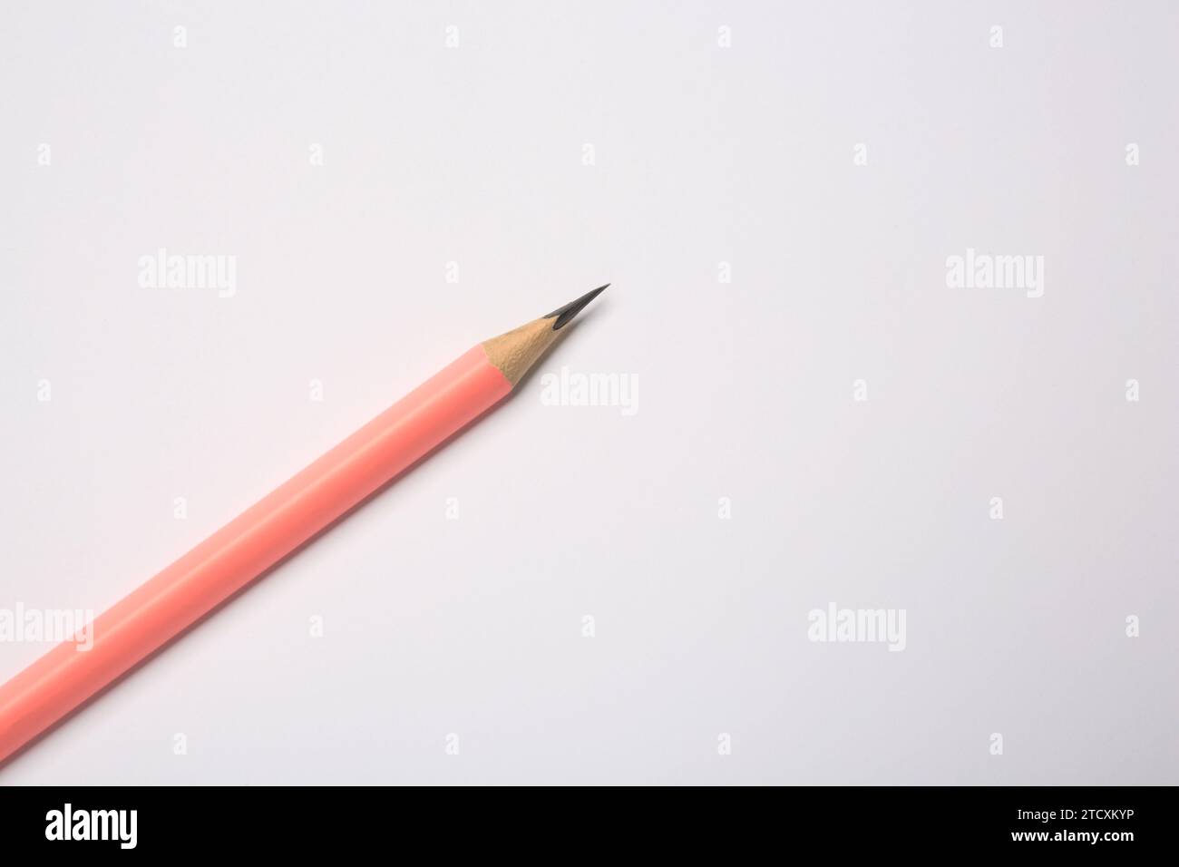 Sharp graphite pencil on white background, top view. Space for text ...