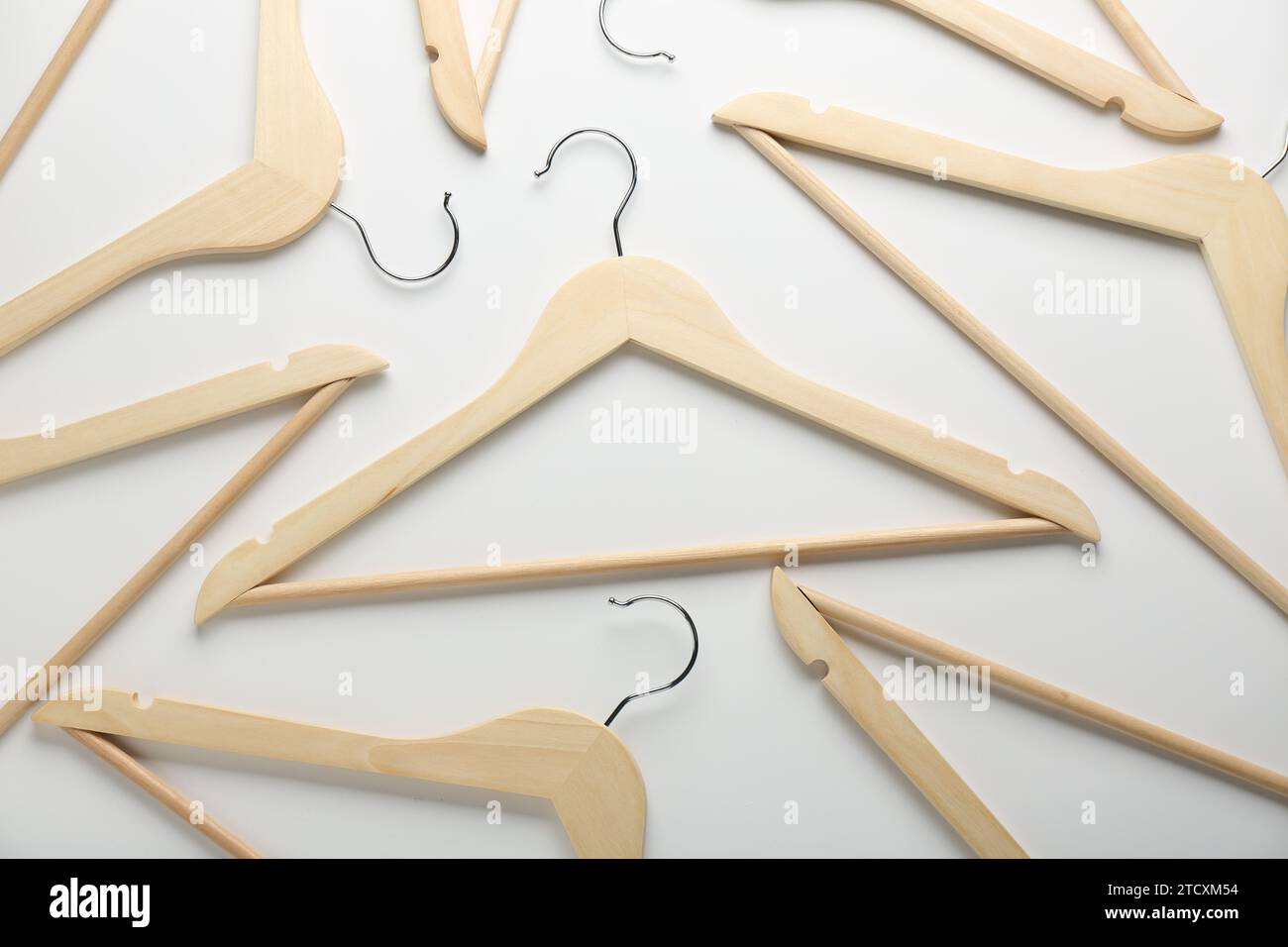 Wooden hangers on white background, flat lay Stock Photo - Alamy