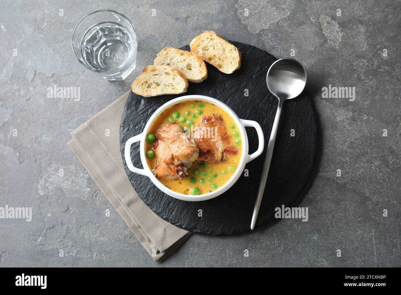 Tasty cooked rabbit meat with sauce served on grey table, top view ...